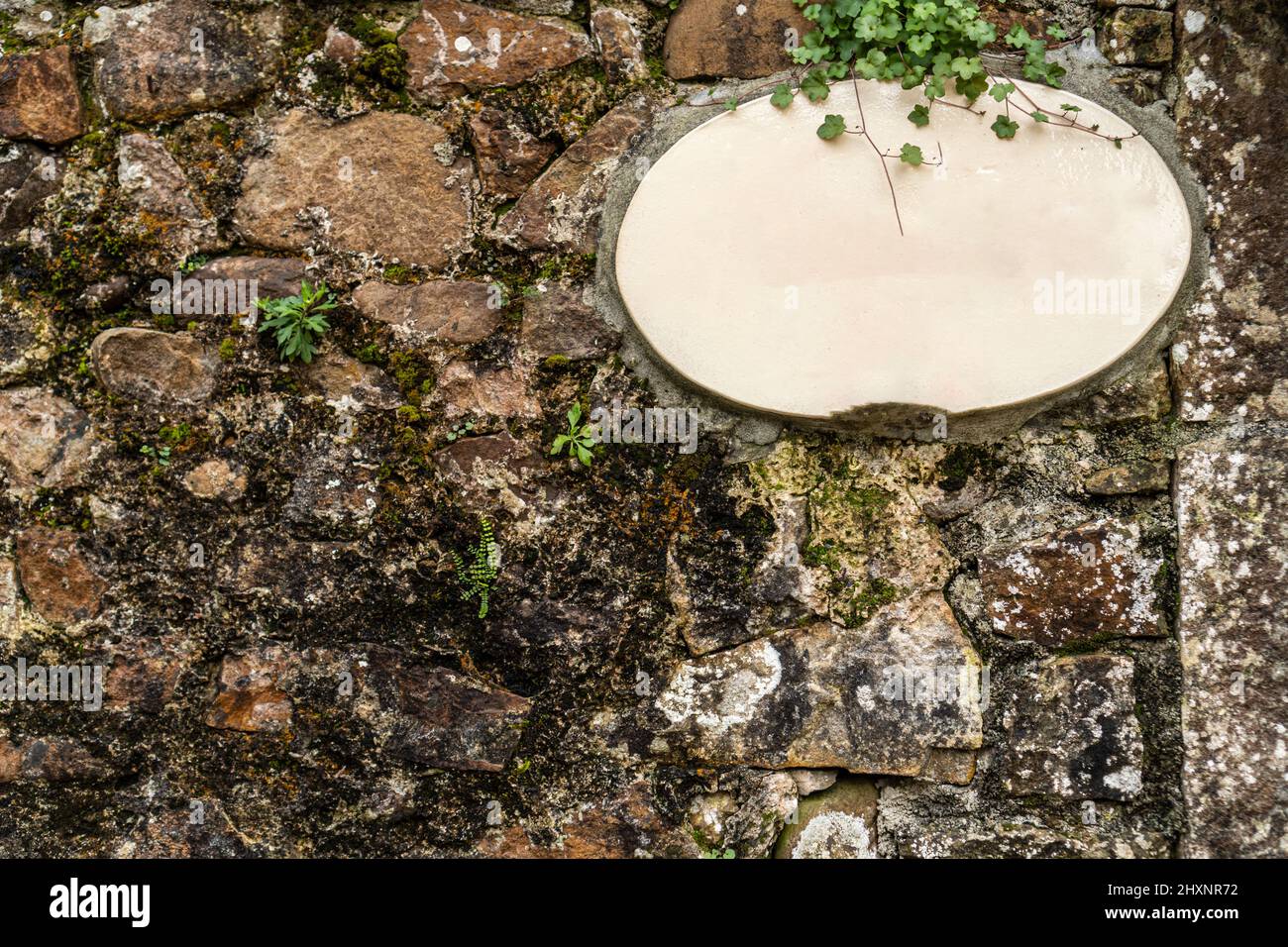 Empty blank house number sign on a stone wall Stock Photo - Alamy