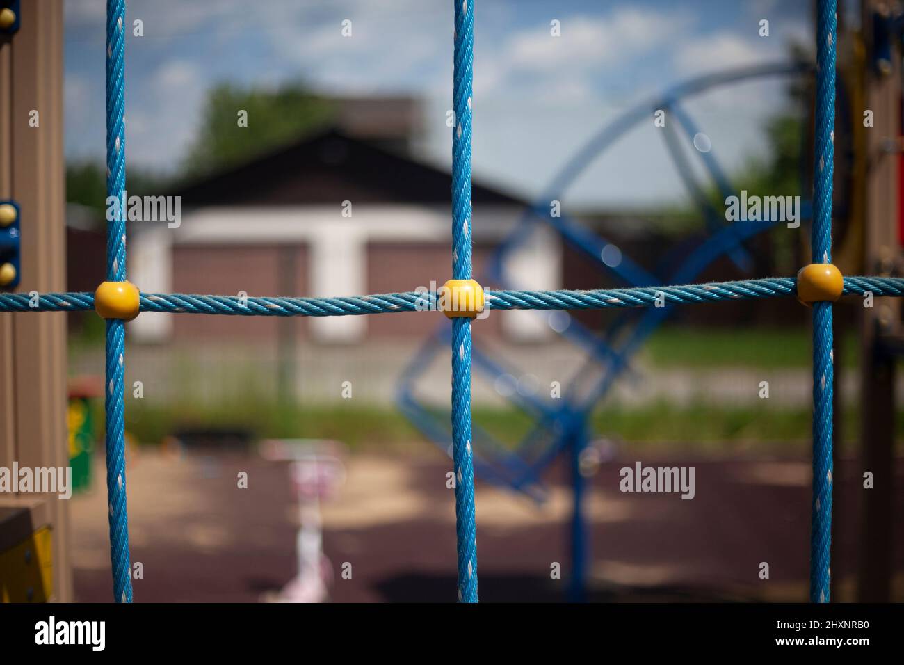 Children's playground in detail. Rope ladder in children's area. Blue ...