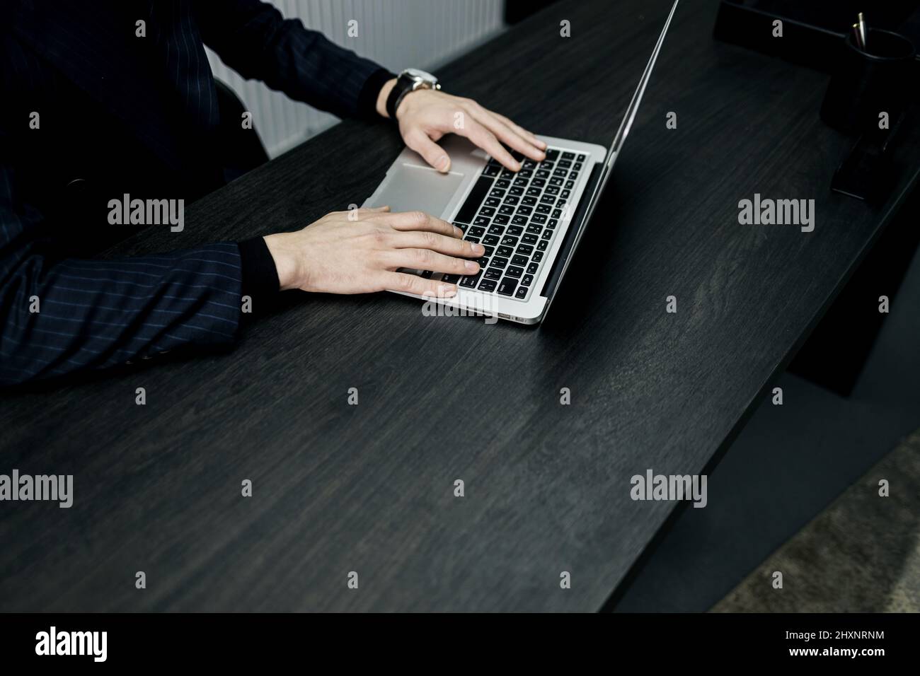 Successful man in suit working on laptop. Connecting Networking Concept ...