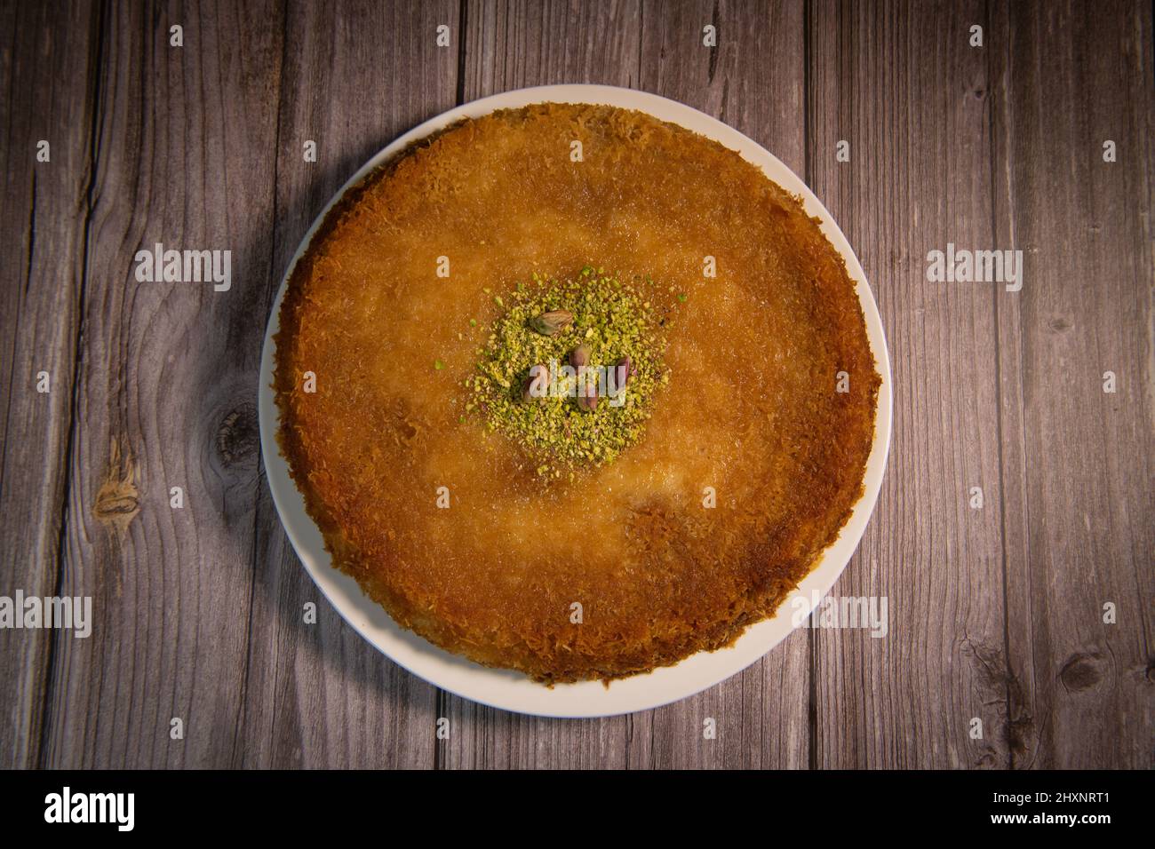 Delicious Traditional Dessert Knafeh with cheese and pistachios and ...