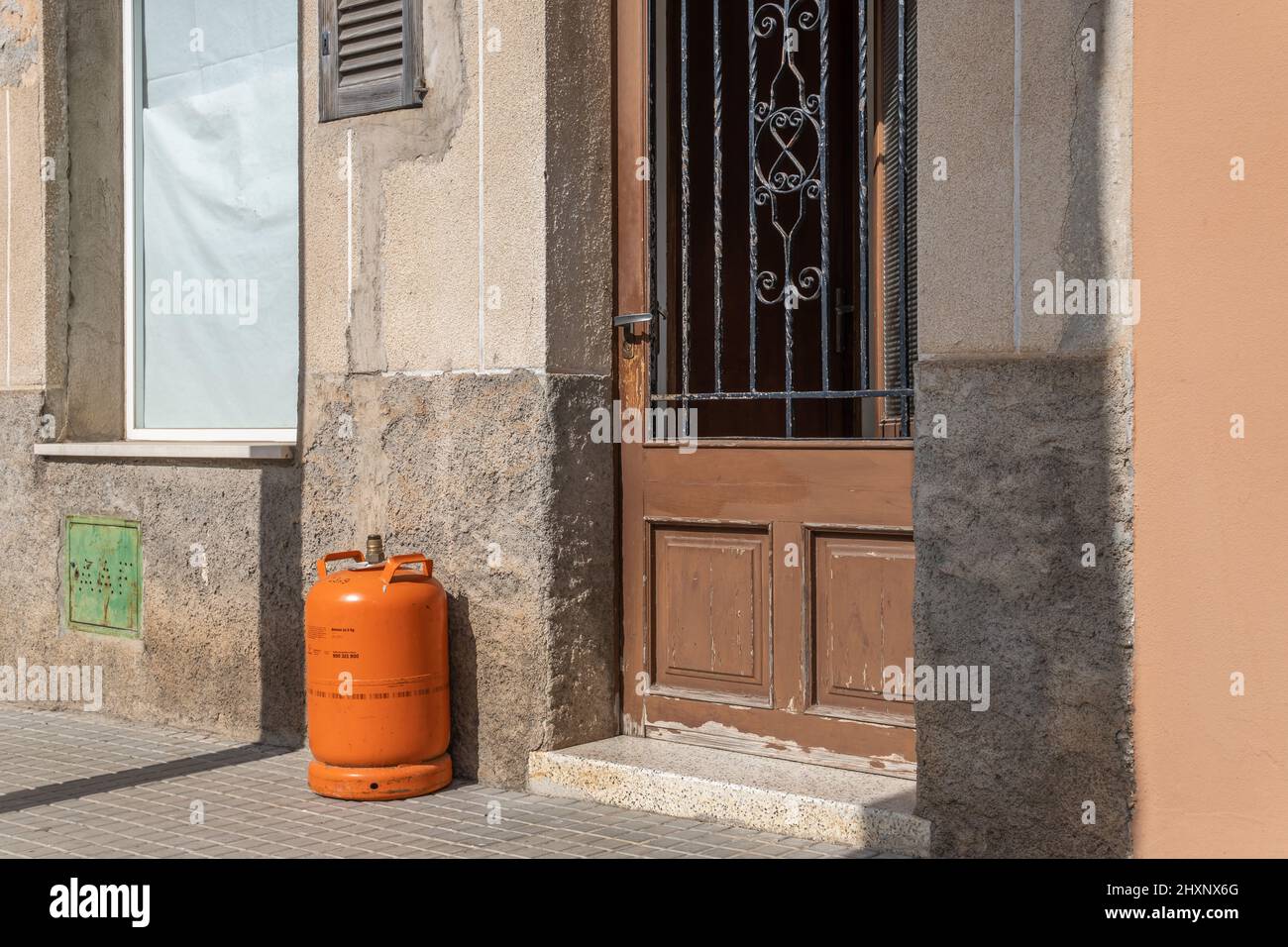 Felanitx, Spain; march 07 2022: Empty butane canister at the door of a ...