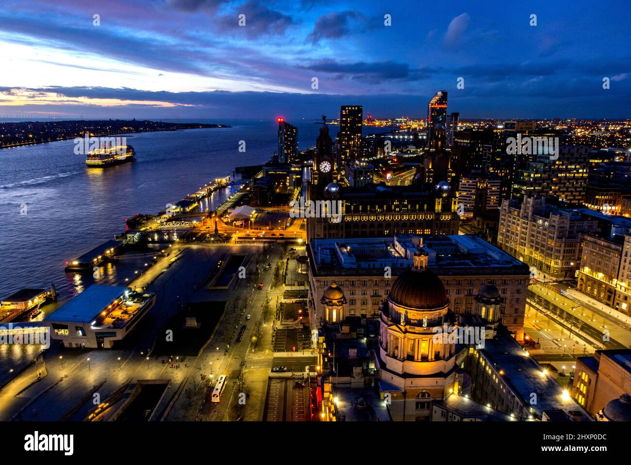 The Borealis cruise liner leaves the port of Liverpool as the sun sets ...