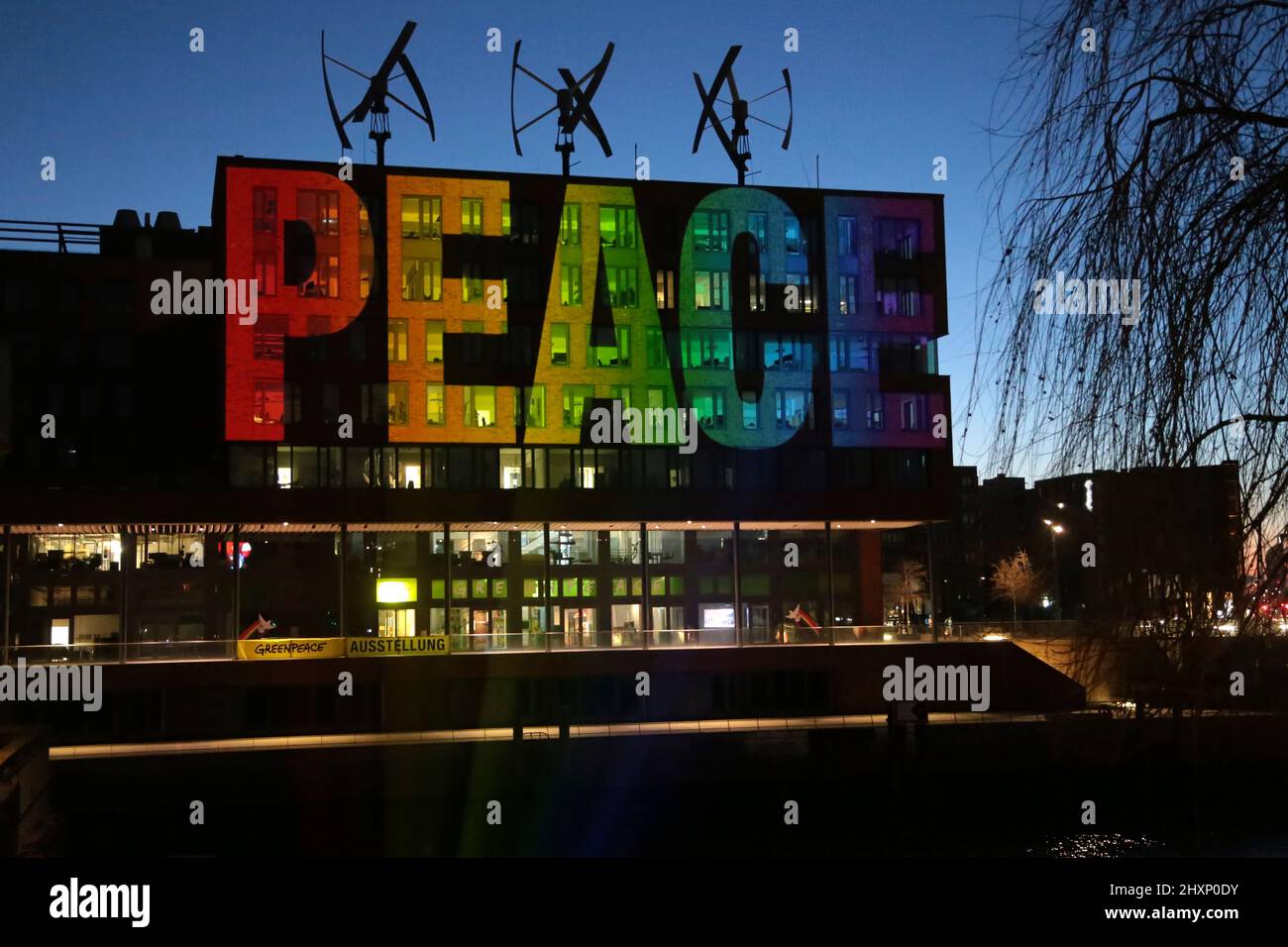 Peace Projection on Headquarter Greenpeace Germany Stock Photo - Alamy