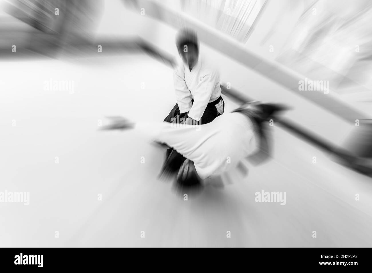 People practicing aikido in a dojo background Stock Photo - Alamy