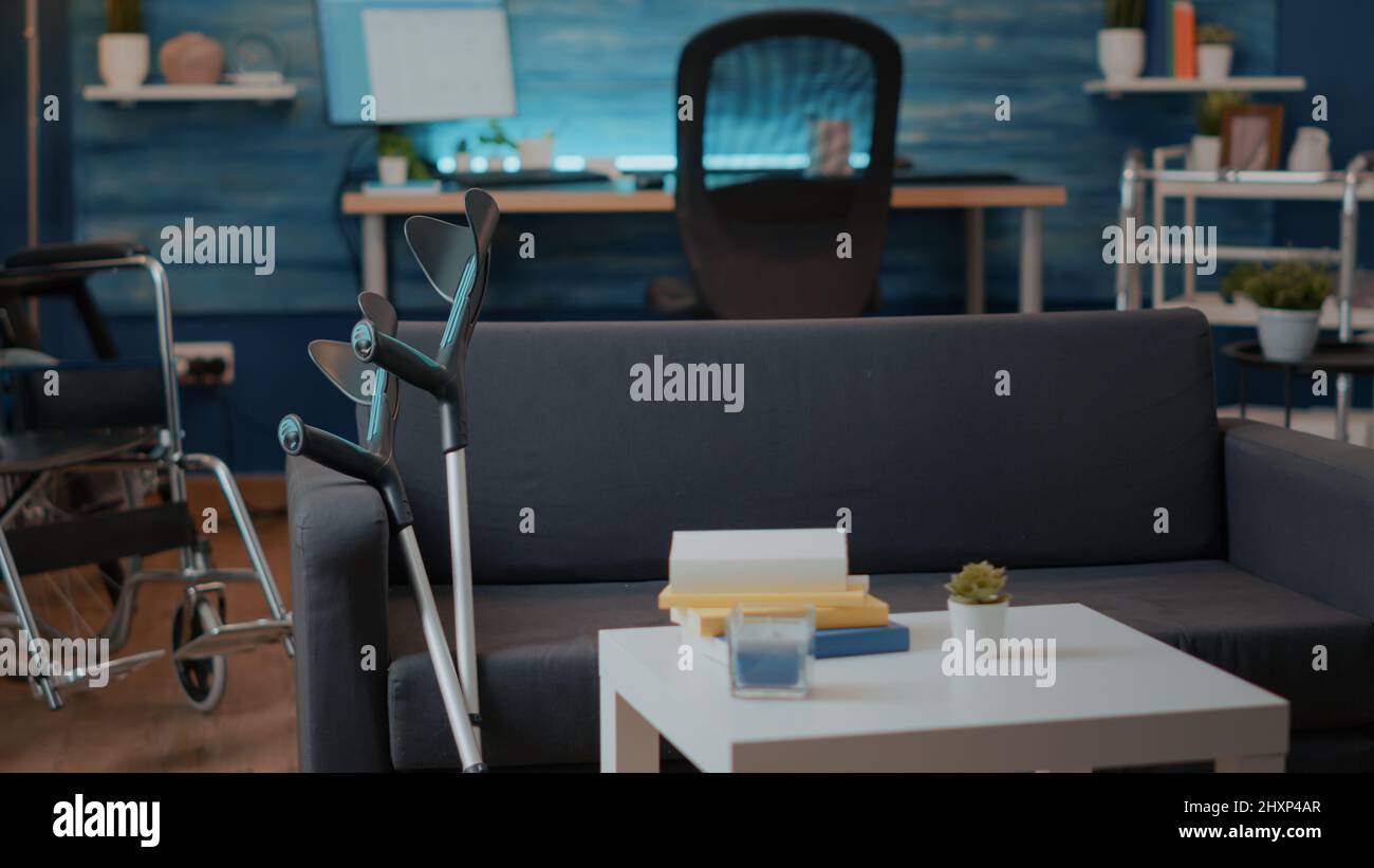 Medical crutches on couch used by person with physical disability ...