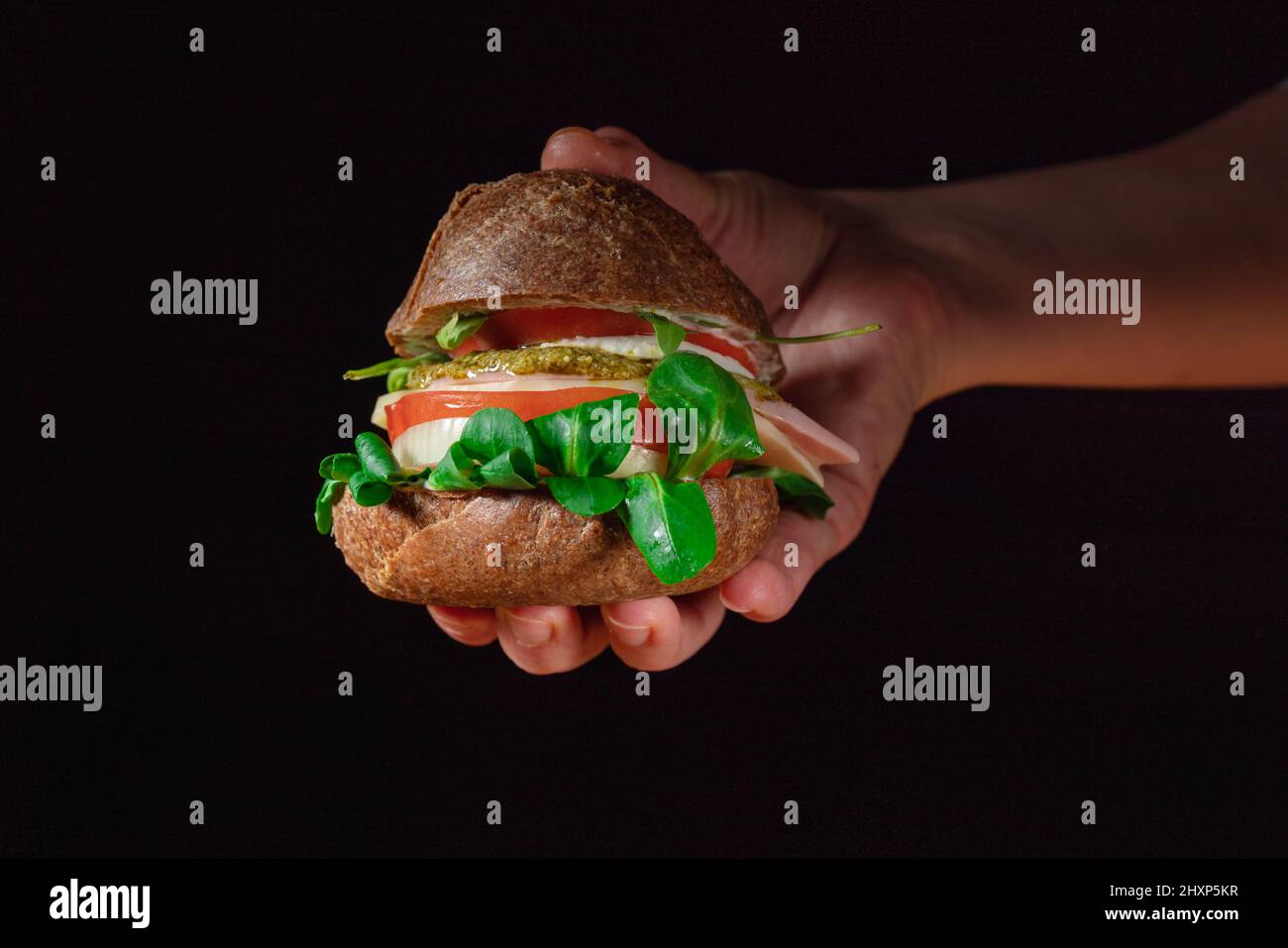 Healthy Vegan Burger. Hamburger in a hand Stock Photo - Alamy
