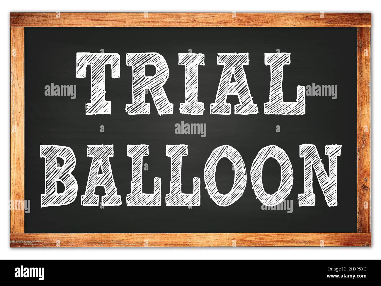 TRIAL BALLOON written on black wooden frame school blackboard Stock ...