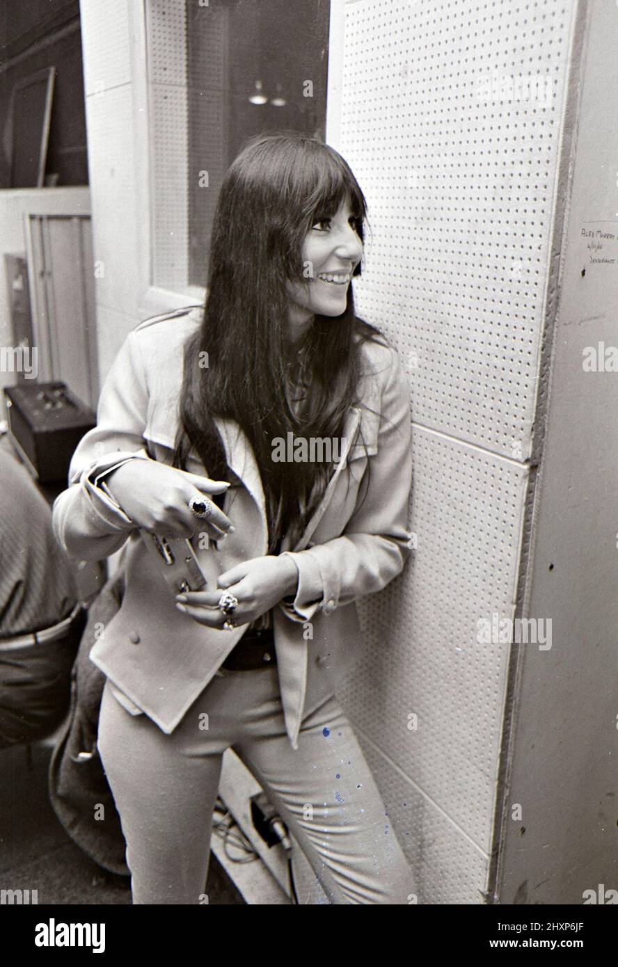 SONNY AND CHER US singer Cher helps out on tambourine during a ...