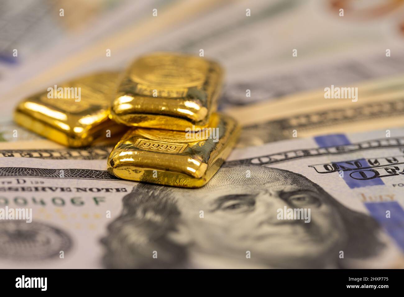 pile of pure gold bars, bullion, ingot on background of US dollar ...