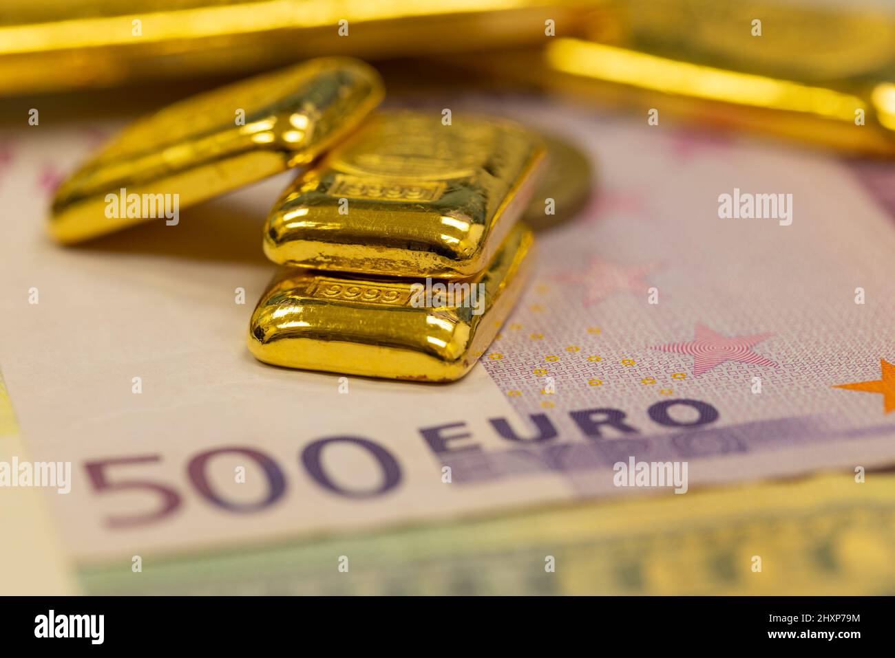pile of pure gold bars, bullion, ingot on background of banknotes of US ...