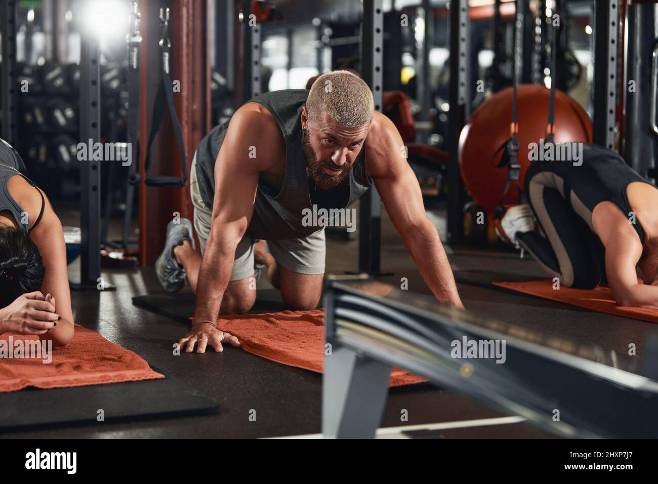 Fitness Gym friend exercising in the gym, team work and togetherness ...