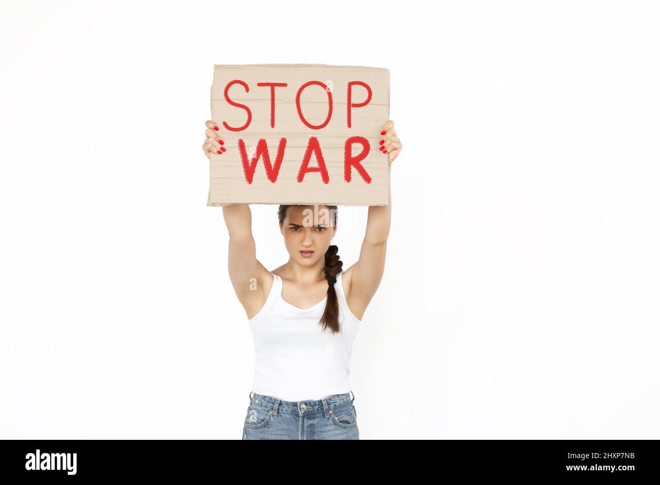 Conceptual portrait of serious sad young woman holding poster with ...