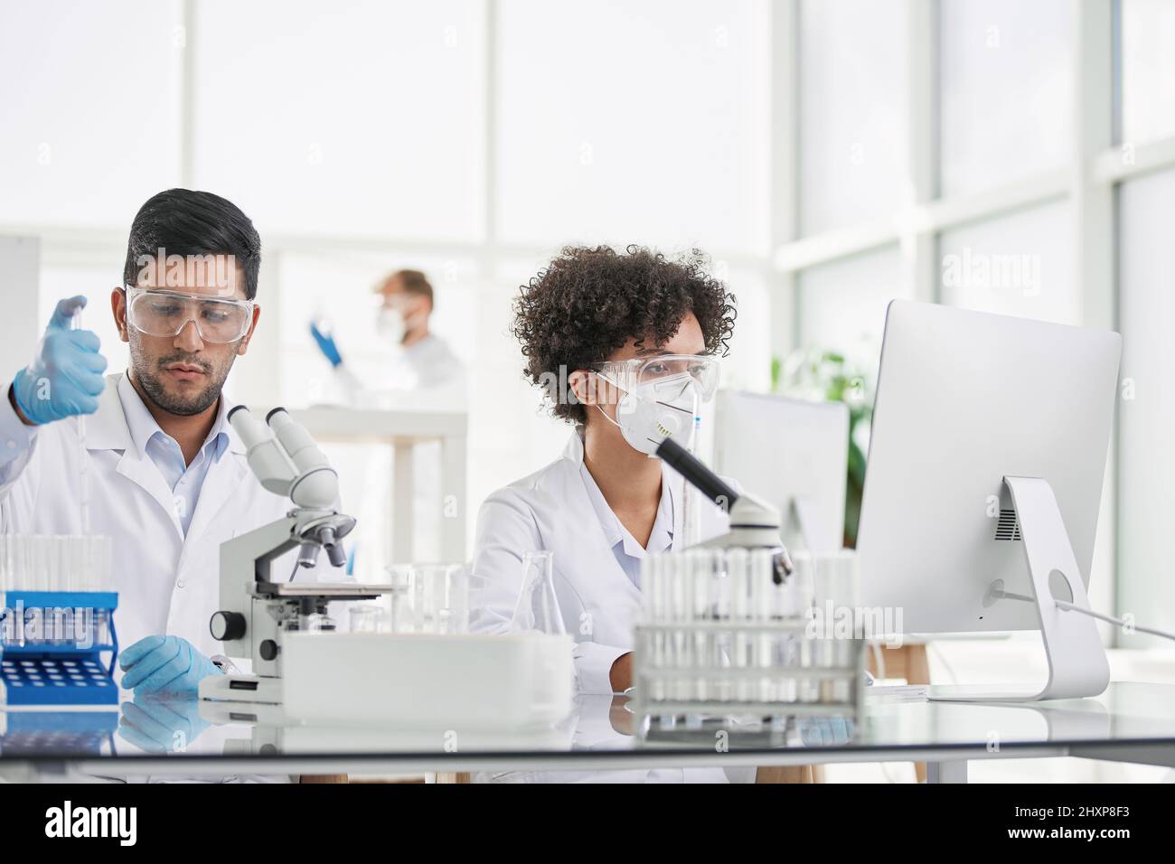 group of employees testing samples in the laboratory Stock Photo - Alamy