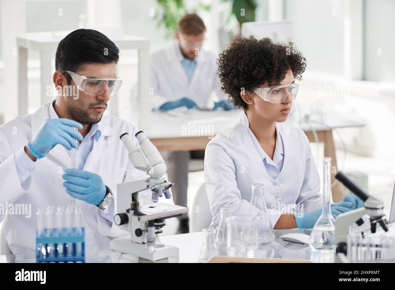 young scientists conduct research in the laboratory Stock Photo - Alamy