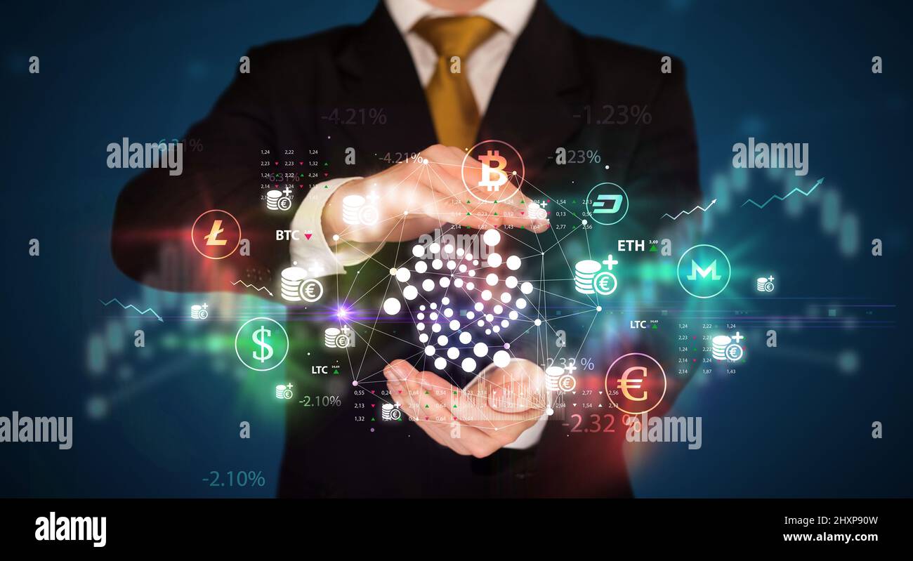 Businessman holding currency symbols concept Stock Photo - Alamy