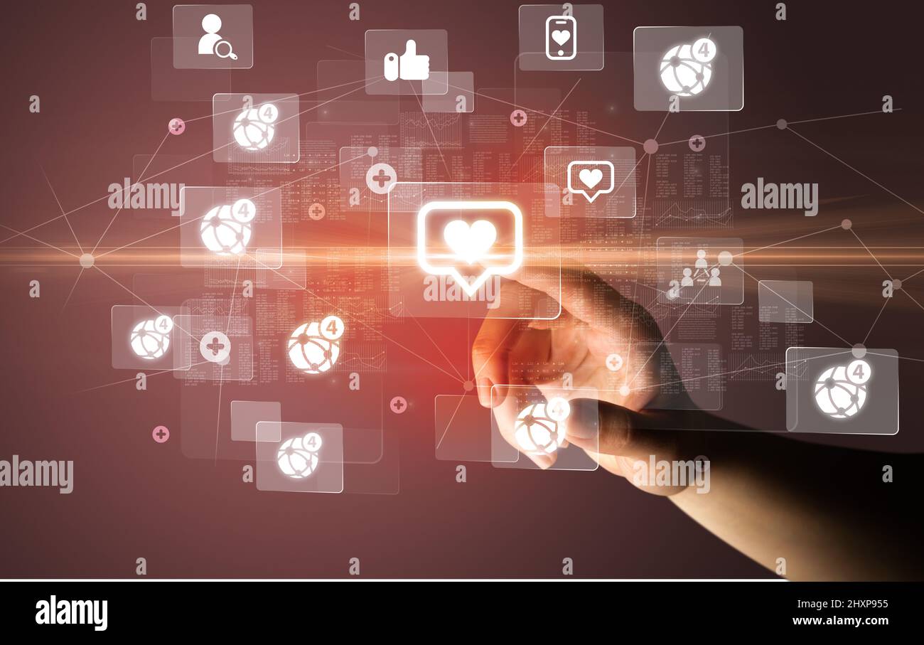 Hand pressing social media multimedia application screen with media ...