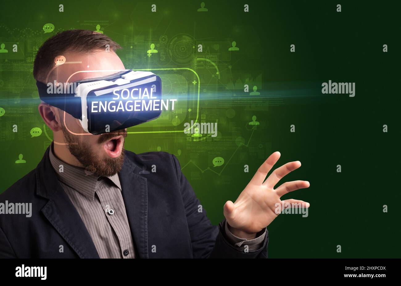 Businessman looking through Virtual Reality glasses, social media ...