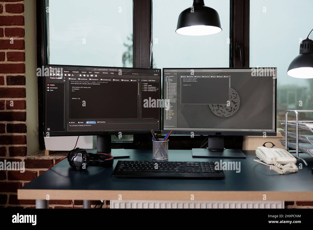 Empty office with nobody in it containing multiple displays showing ...