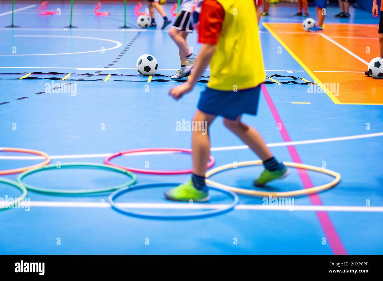 Indoor Soccer Class for Kids at School Sports Hall. Children Kicking ...