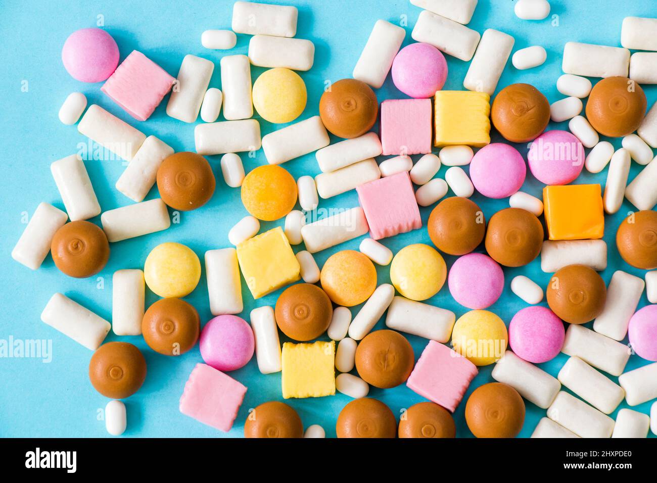 Sweet colorful confectionery, candy on the color background, high angle ...