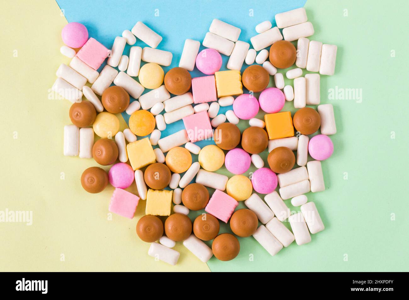 Sweet colorful confectionery, candy on the color background, high angle ...