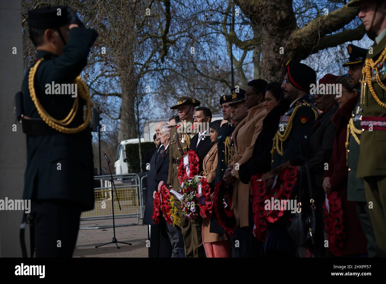 Guests during a commemorative ceremony and laying of wreaths at the ...