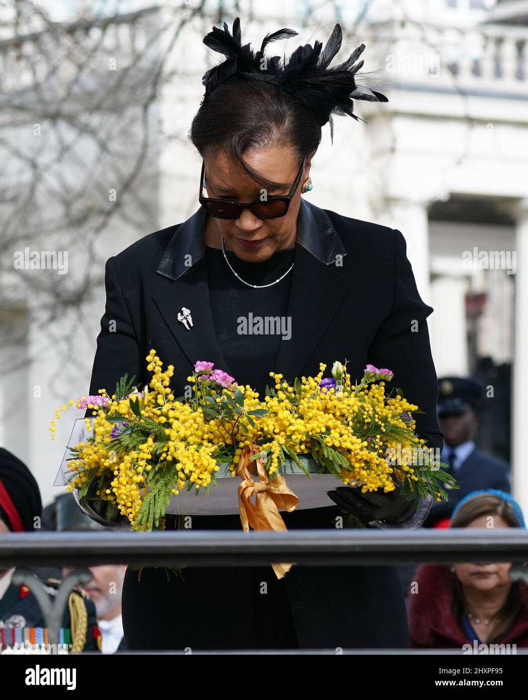 Baroness Scotland lays a wreath during a commemorative ceremony at the ...