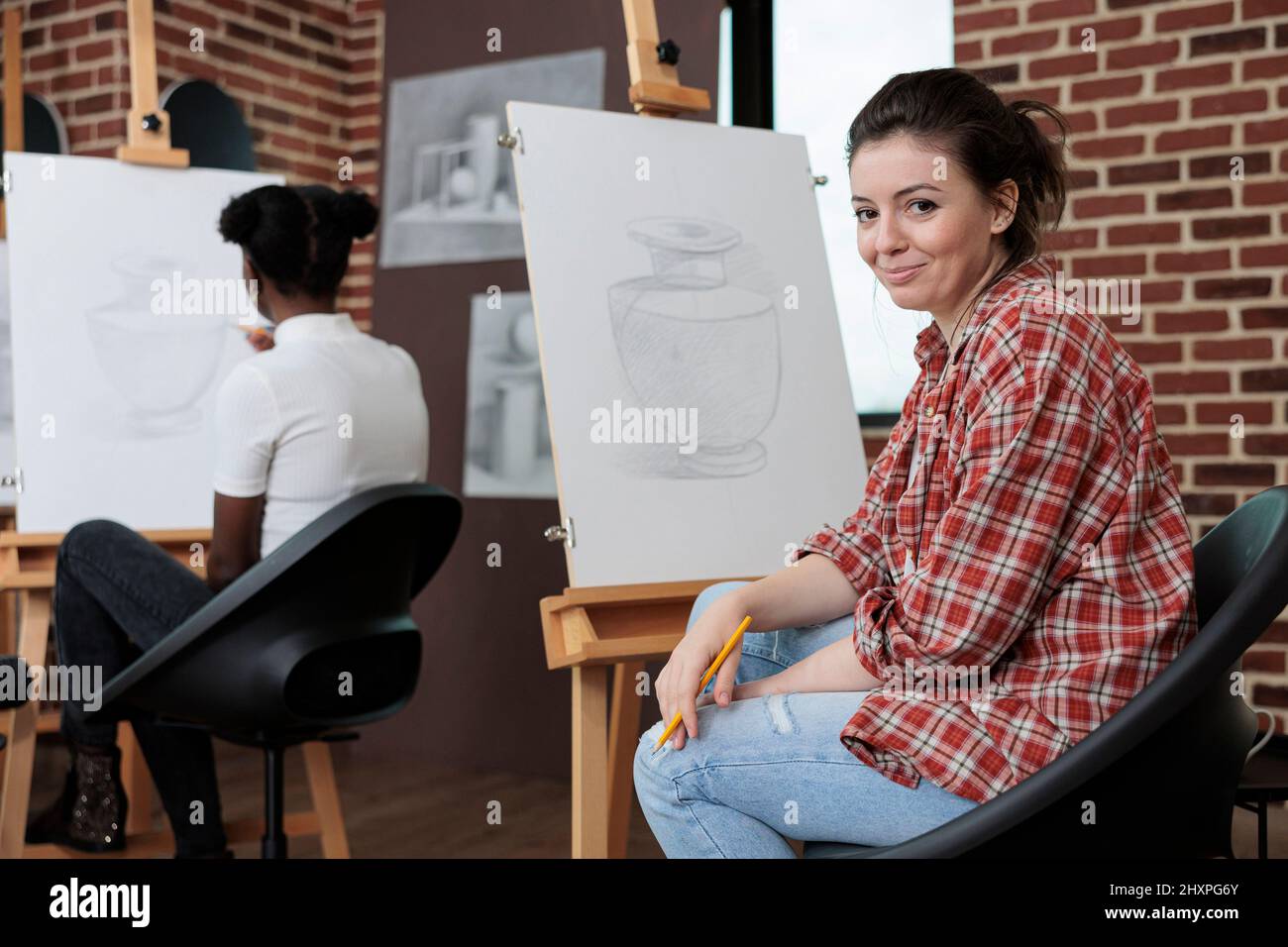 Portrait of woman student working at illustration masterpiece drawing ...