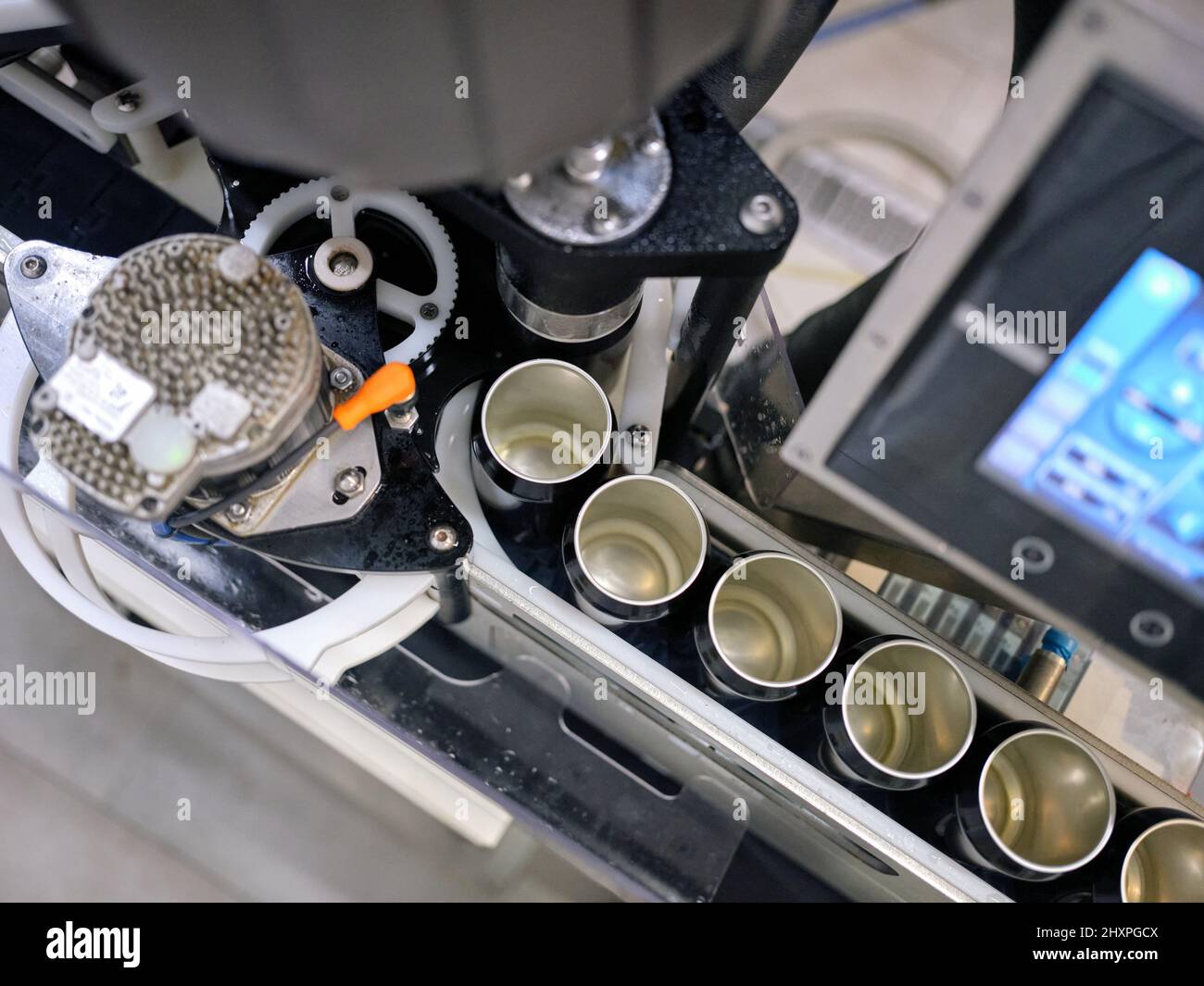 Top view of a raw of cans in a production line of a canning factory ...
