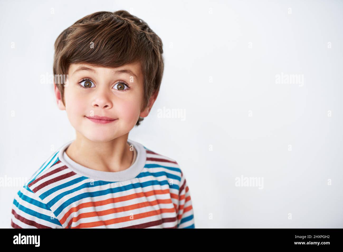 Stop staring now. Shot of a cute little boy looking at the camera Stock ...