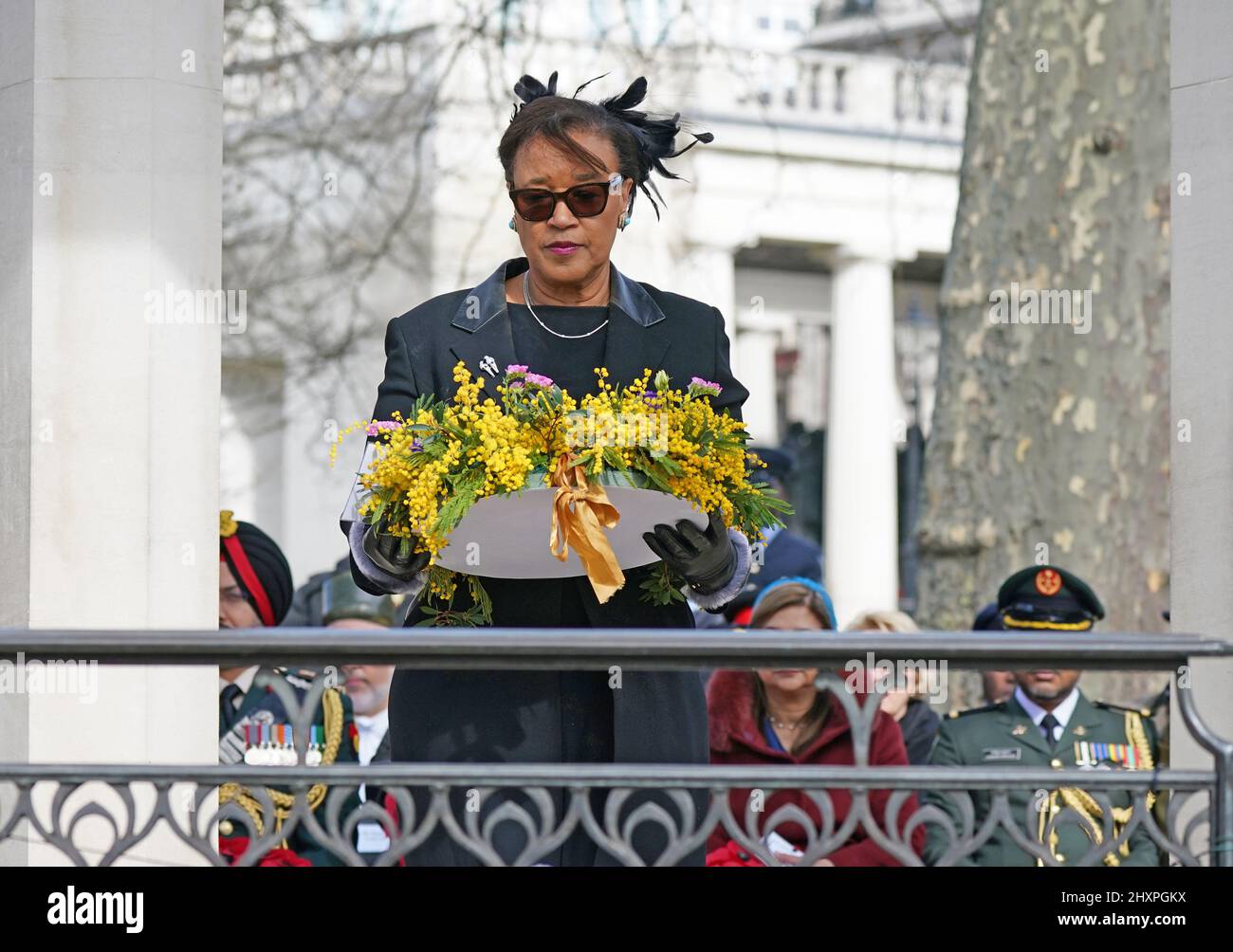 Baroness Patricia Scotland lays a wreath during a commemorative ...