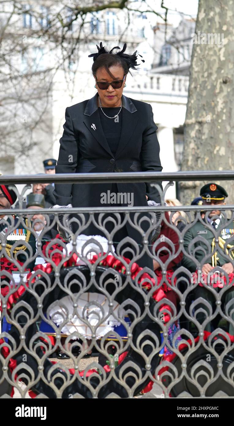Baroness Patricia Scotland lays a wreath during a commemorative ...