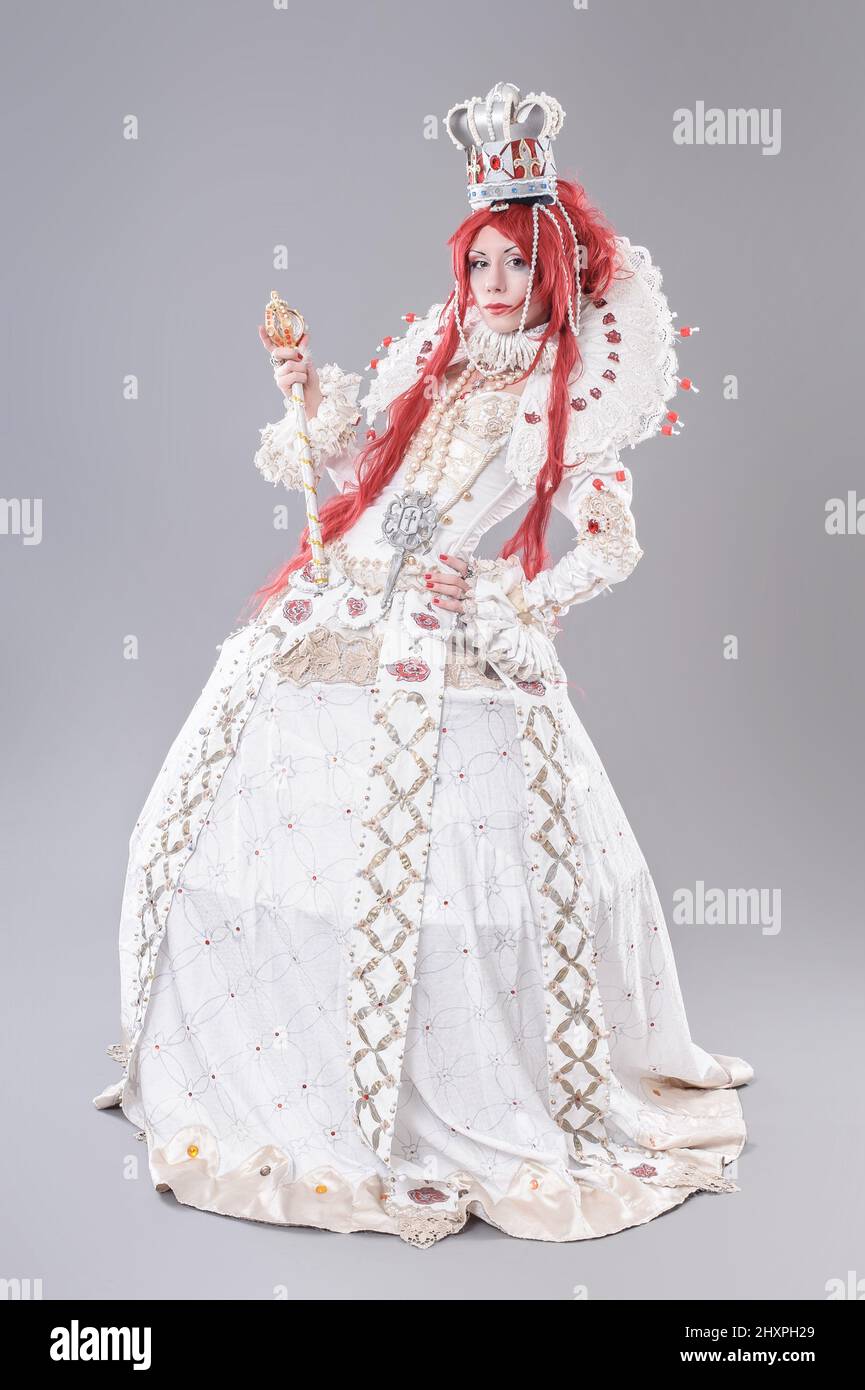Queen wizard. Model dressed in renaissance style on gray background ...