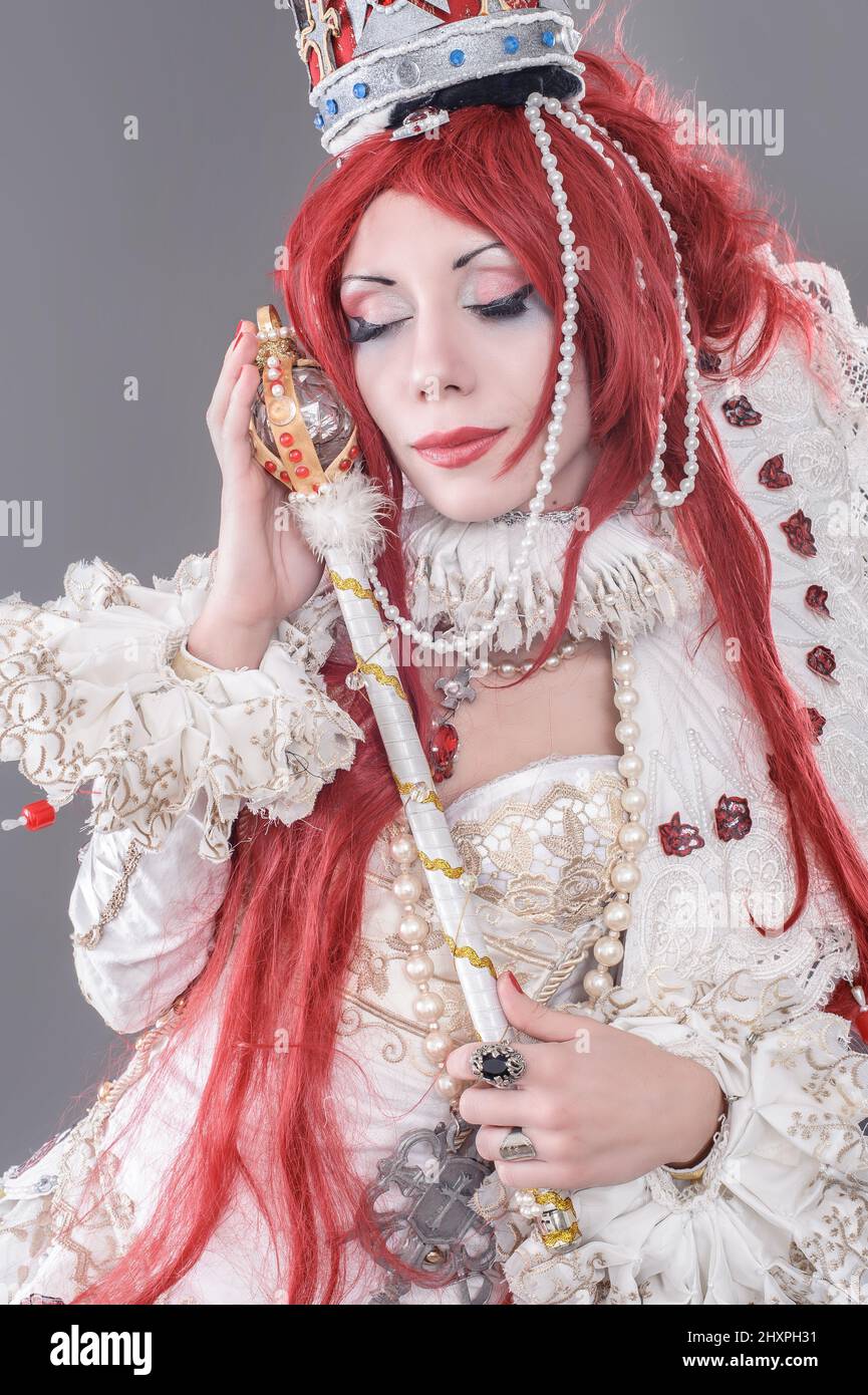 Queen wizard. Model dressed in renaissance style on gray background ...