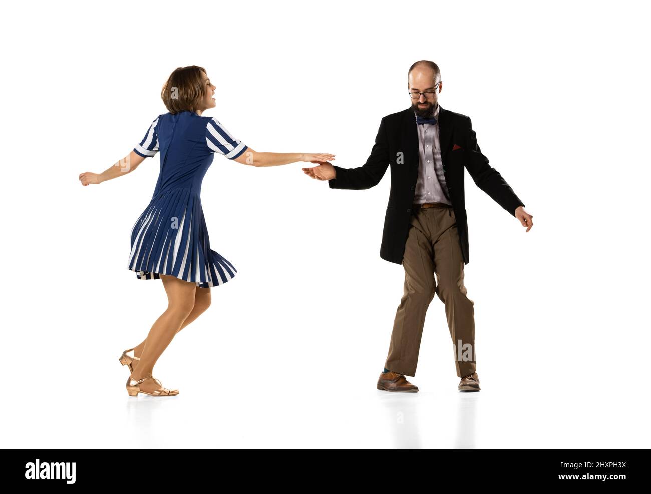 Social dancing. Couple of dancers, young man and woman in vintage retro ...
