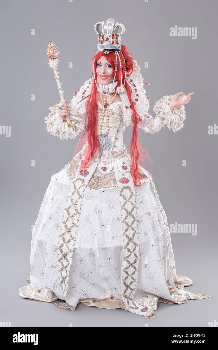 Queen wizard. Model dressed in renaissance style on gray background ...
