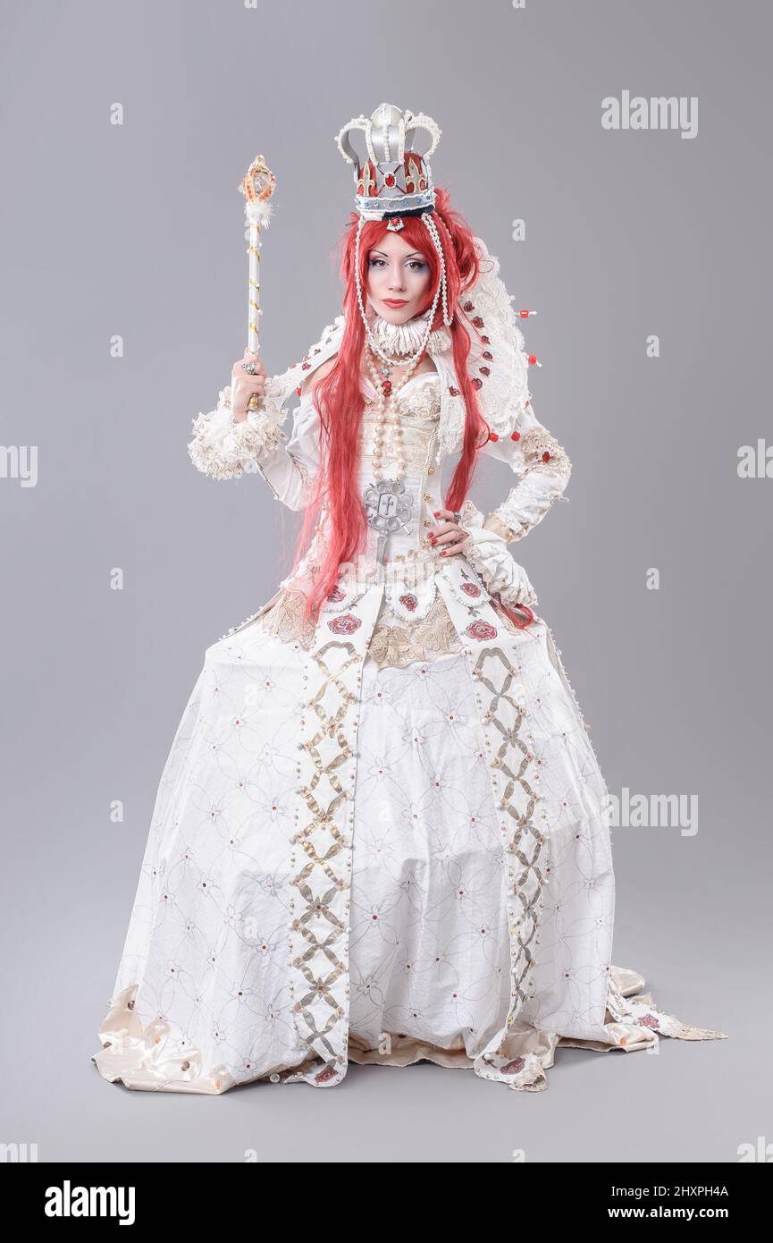 Queen wizard. Model dressed in renaissance style on gray background ...