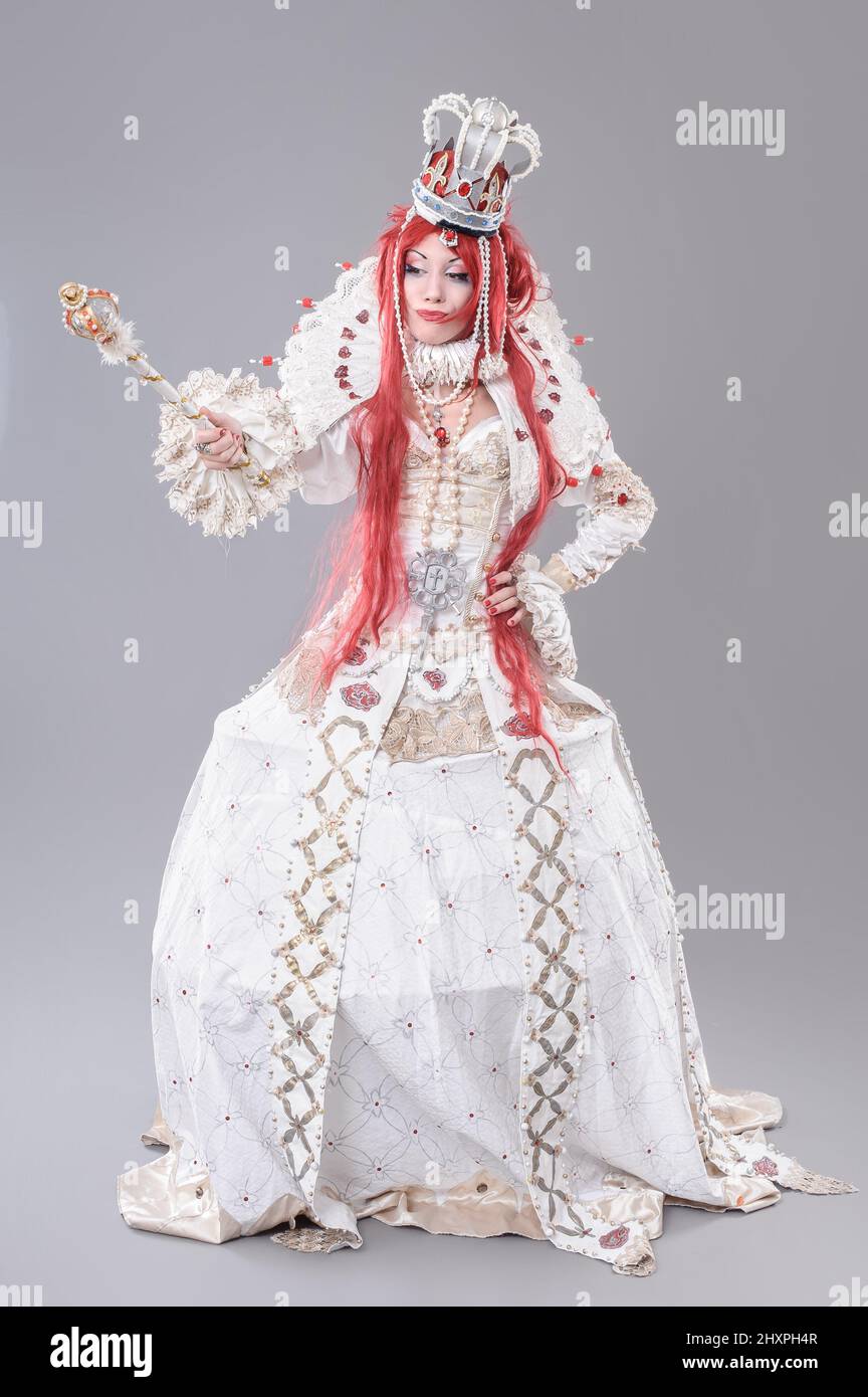 Queen wizard. Model dressed in renaissance style on gray background ...
