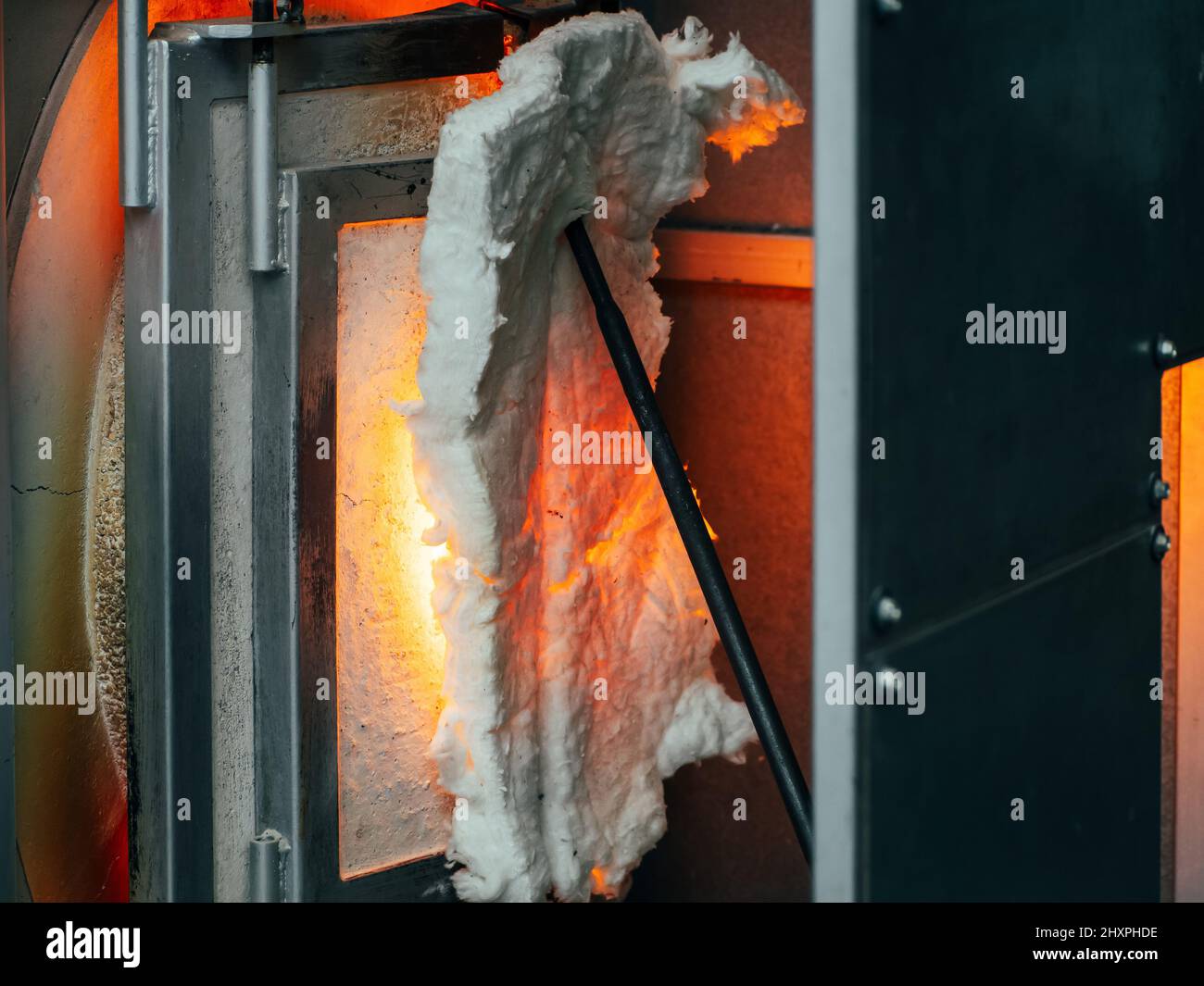 Closed red-hot furnace with fire to make the glass, close up photo ...