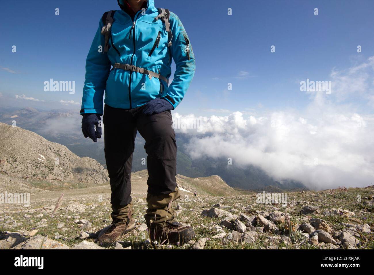 Mountain climber in blue coat Stock Photo - Alamy