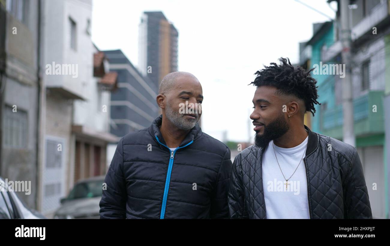 A parent giving life advice to adult son in 20s Stock Photo - Alamy