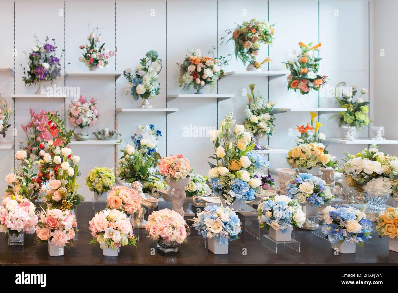 Decorative bouquets of colorful flowers on the shop showcase Stock ...