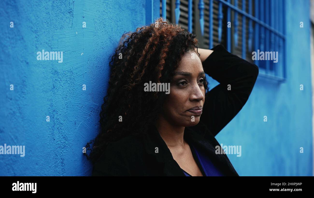 An Anxious African woman having difficult times feeling stressed out ...
