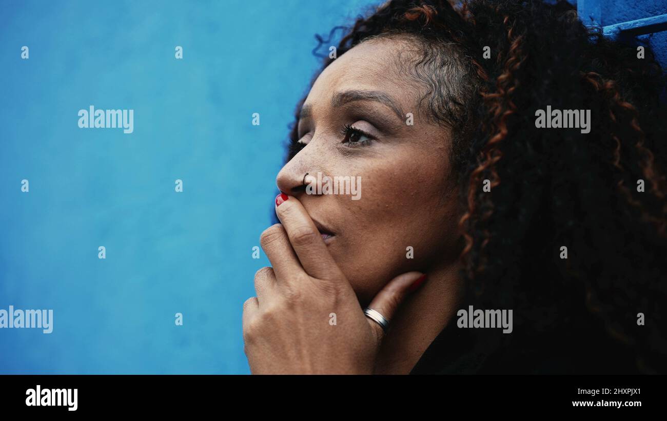 An Anxious African woman having difficult times feeling stressed out ...