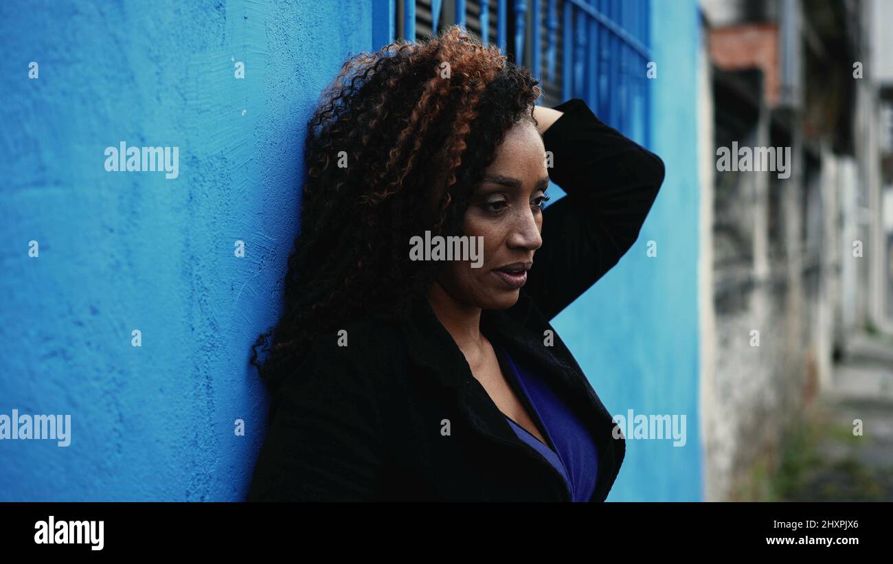 An Anxious African woman having difficult times feeling stressed out ...
