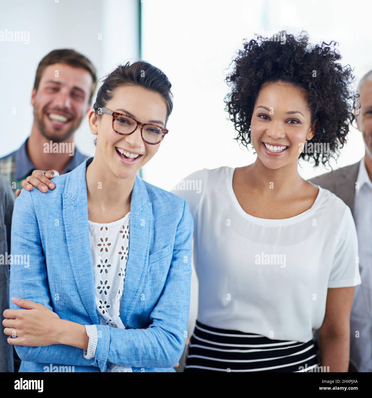 Teamwork with a smile. Portrait of two female coworkers smiling in an ...
