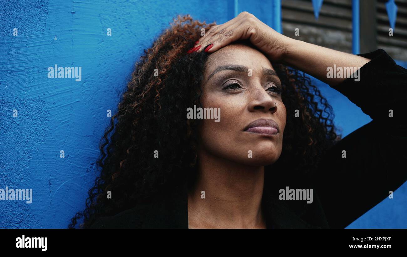An Anxious African woman having difficult times feeling stressed out ...