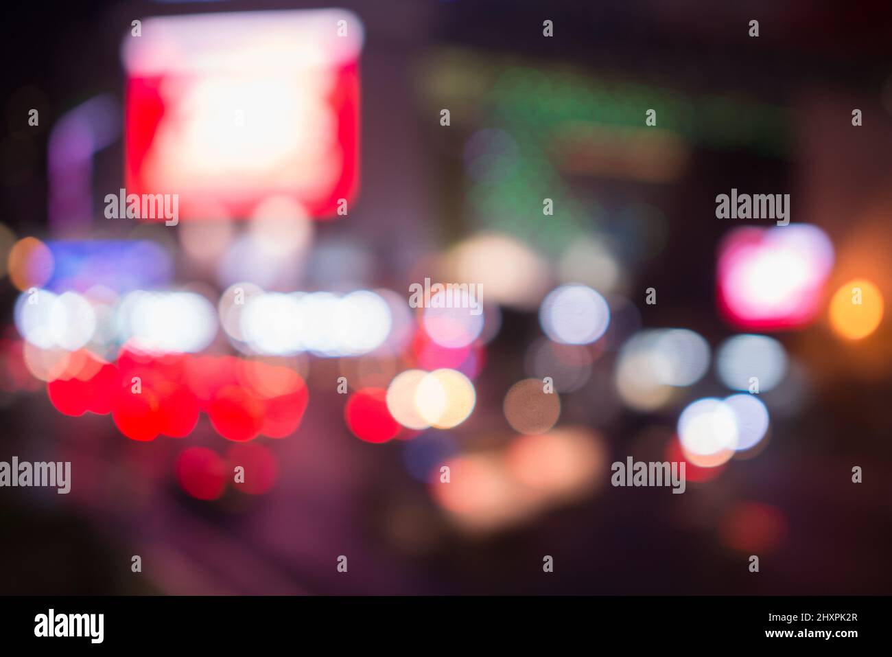 Blurred street lights, urban abstract background. defocused image of ...