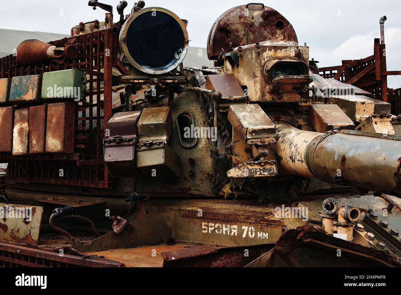 Damaged tank, a war machine. Tank with additional protection against ...