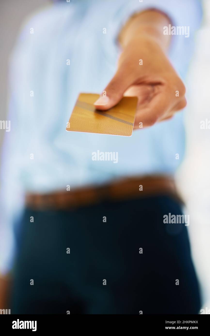I need it take my money. Shot of someone giving a credit card to make a ...
